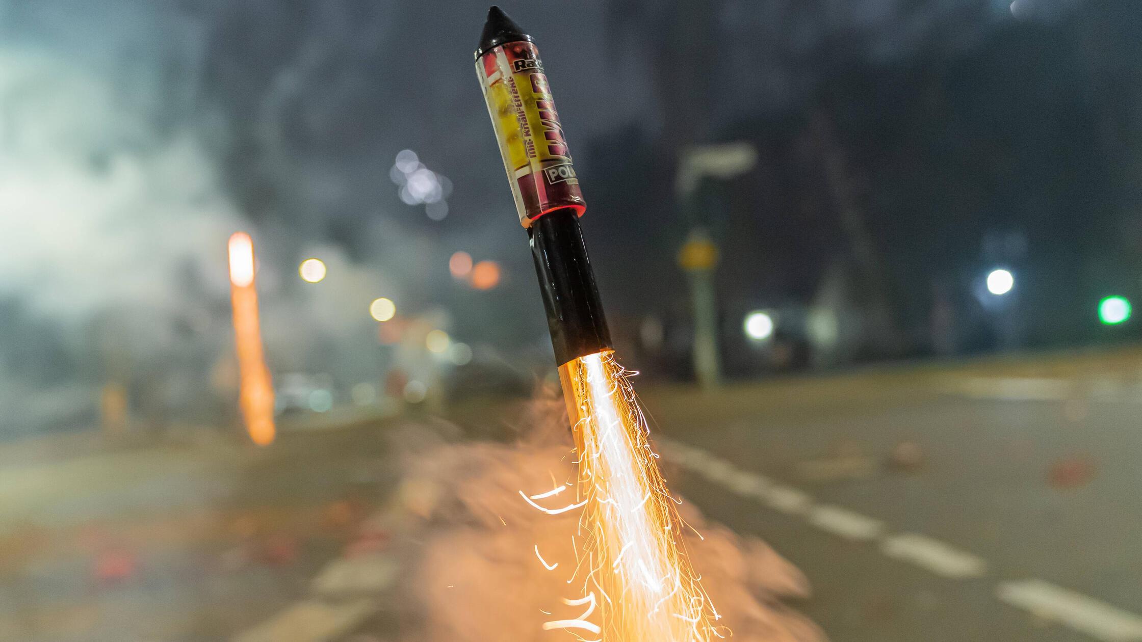 Dangerous stunt: Teenagers in Franconia aim a firework at a man
